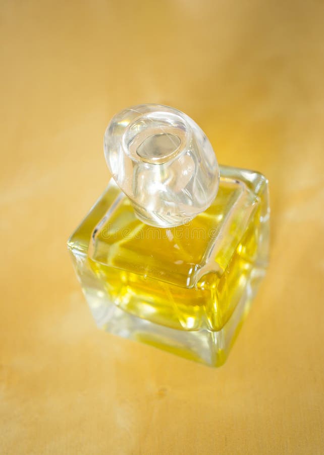 Yellow perfume bottle stock image. Image of table, bottle - 44741411