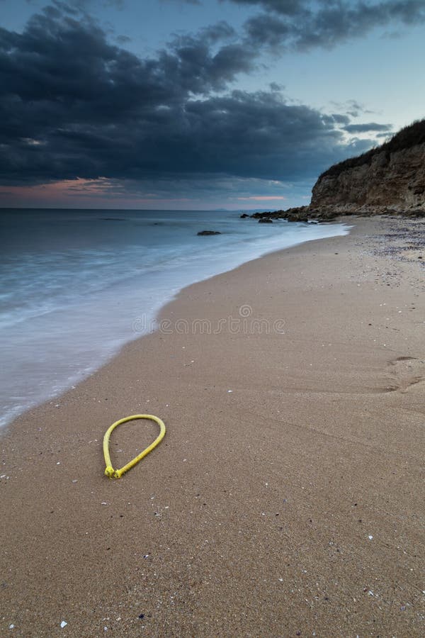 Yellow Piece of Rope on the Beach Stock Photo - Image of ocean, heart ...