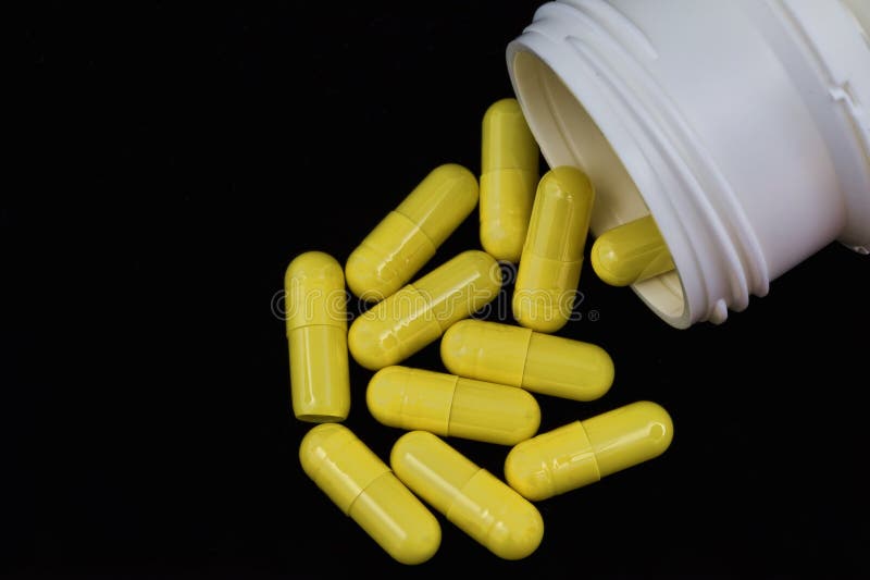 Yellow pill stock image. Image of painkillers, white - 19102793
