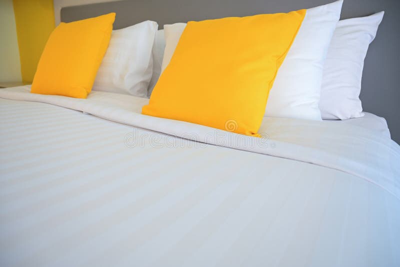 Yellow Pillow on White Bed in the Clean Room, Interior Design Stock ...