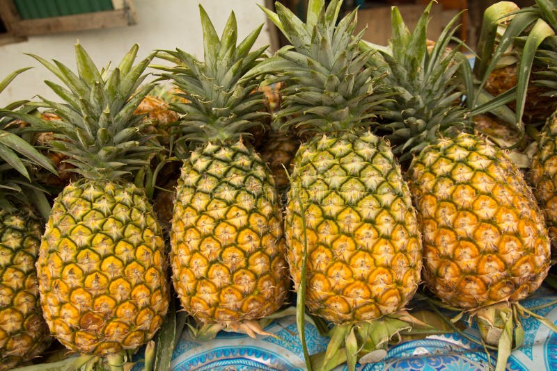 Yellow pineapples stock photo. Image of leaves, bunch - 31960620