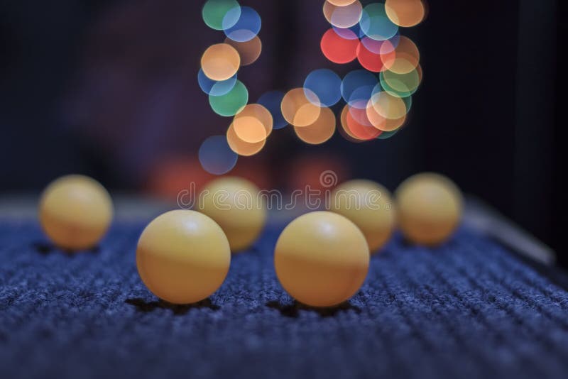 Yellow Ping Pong Ball, with Bokeh Background, on Black Background Stock ... Yellow Ping Pong Ball, with Bokeh Background, on Black Background Stock ...