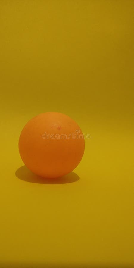 A Yellow Ping Pong Ball with a Striking Yellow Stock Photo - Image of ...