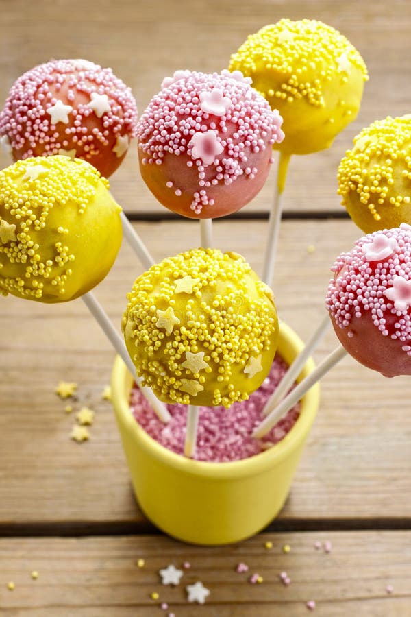 Yellow and pink cake pops stock image. Image of making - 46204599