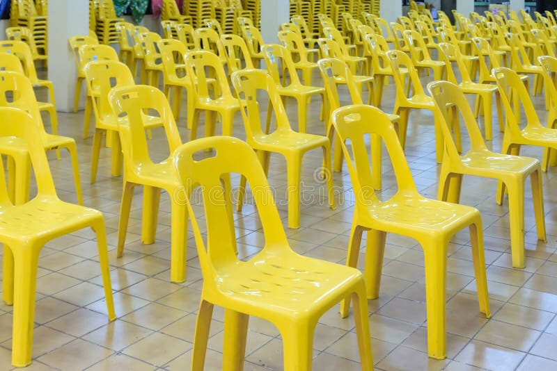 Yellow plastic chair stock photo. Image of furniture - 211446478