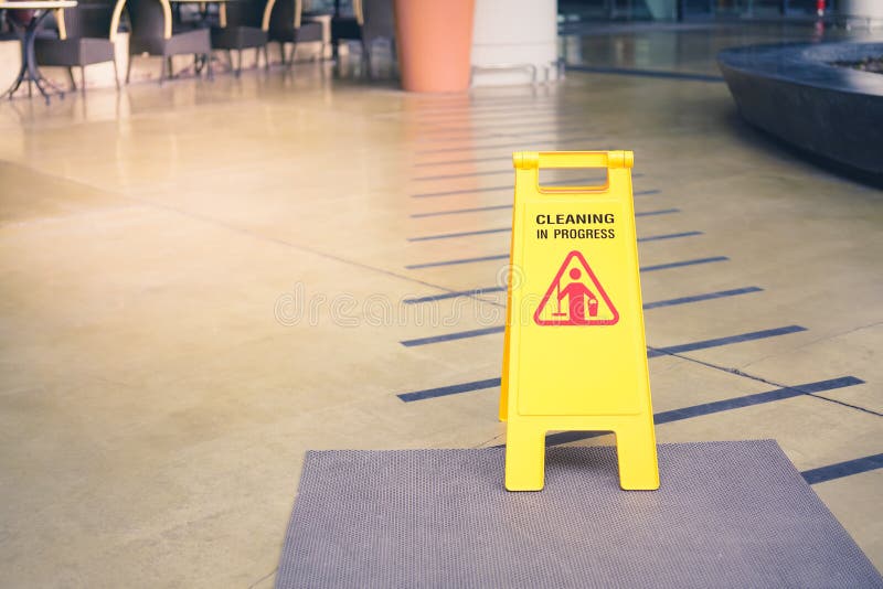 Yellow Plastic Cleaning in Progress Sign Stock Photo - Image of ...