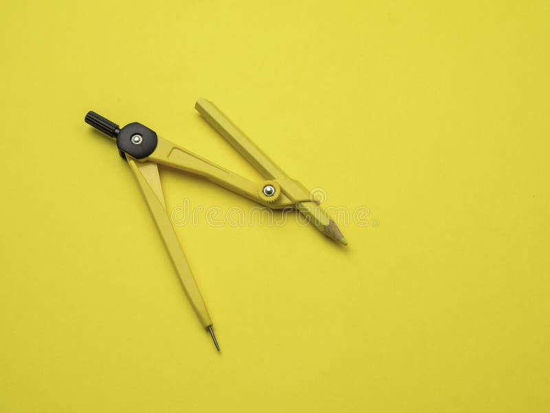 Yellow Compass Over a Yellow Background Stock Image - Image of ...