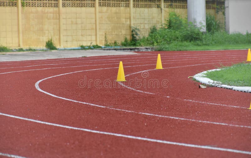 Yellow Plastic Funnel for Athlete Use Practice on Running Track Stock ...