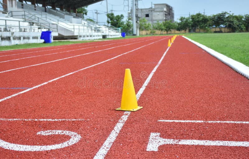 Yellow Plastic Funnel for Athlete Use Practice on Running Track Stock ...
