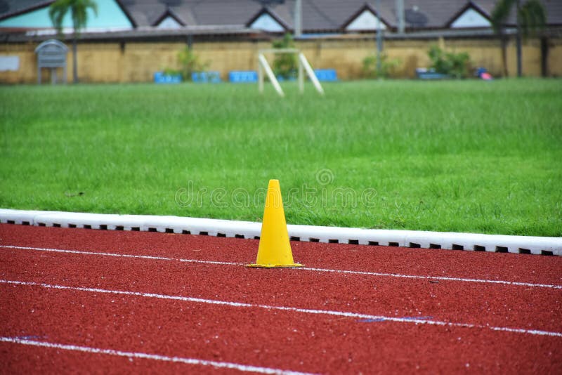 Yellow Plastic Funnel for Athlete Use Practice on Running Track Stock ...