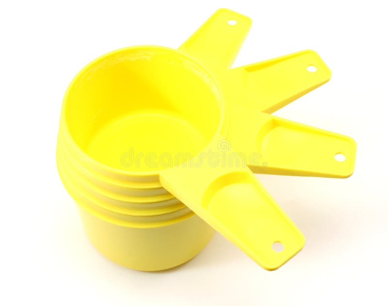 Yellow Plastic Measuring Cups Stock Photo - Image of measure, isolated ...