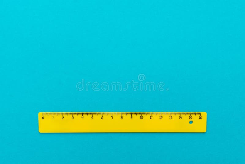 Yellow Plastic Ruler on the Turquoise Blue Stock Image - Image of ...