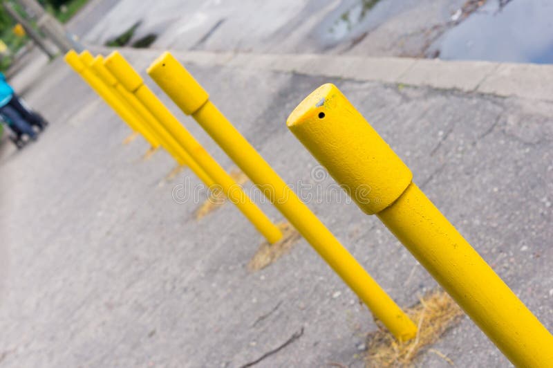Yellow poles stock photo. Image of yellow, sidewalk, outdoor - 40783936