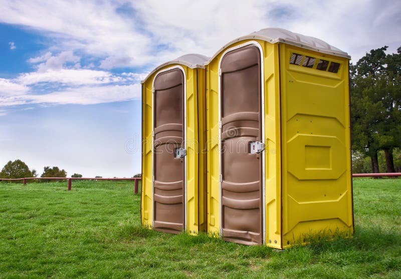 Yellow portable toilets stock photo. Image of green, outdoors - 30690458