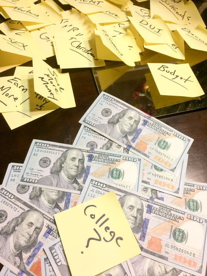 Yellow Post it Notes on Table with Pile of American Cash Stock Photo ...