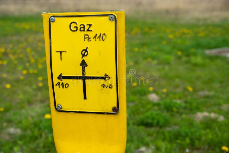 Yellow Post Sign with Gas Markings Stock Image - Image of symbol ...
