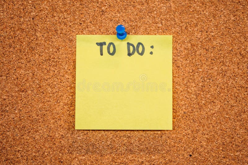 Yellow Post-it Sticky Note on a Cork Board Stock Photo - Image of note ...