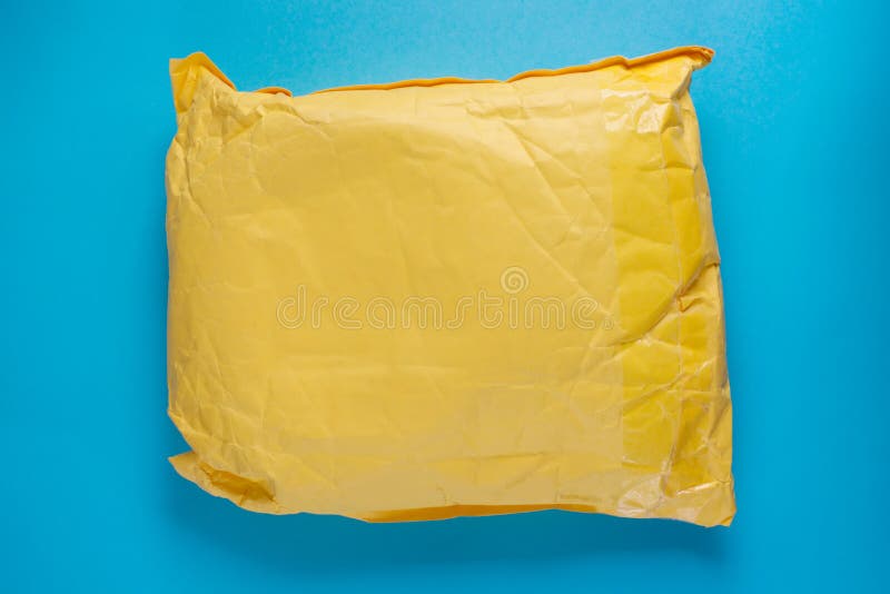Yellow Postal Cardboard Package on Blue Background Stock Image - Image ...