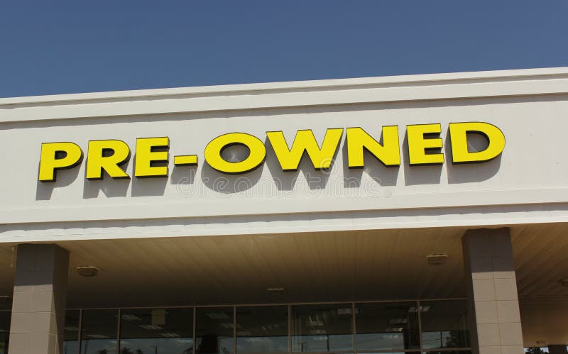 Yellow Pre-owned Sign on Car Dealership Building Front Stock Image ...
