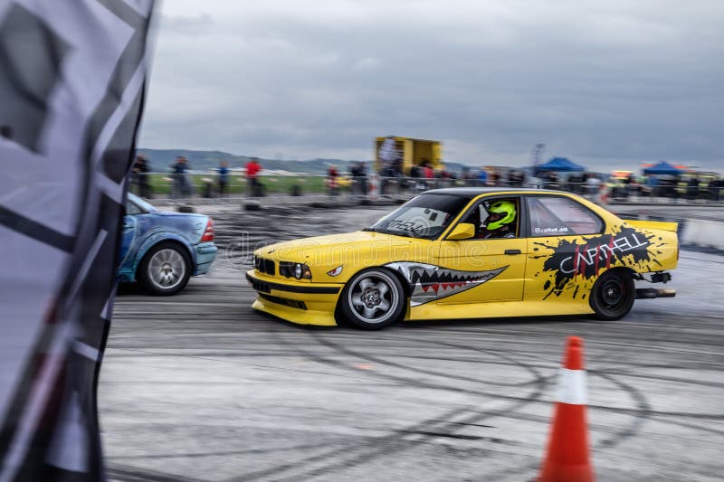 Yellow Race Cars Navigating a Turn at a Car Race Editorial Photography ...
