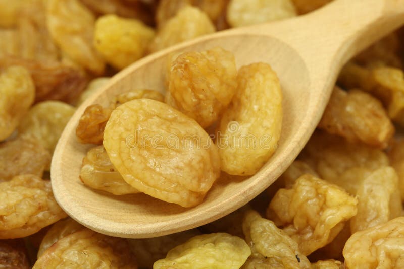 Yellow Raisins in a Wooden Spoon Background Stock Image - Image of ...