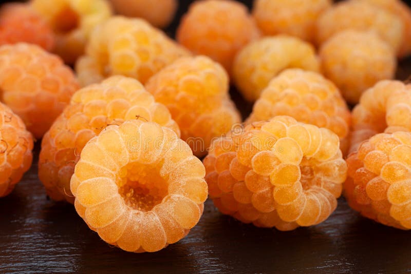 Yellow Raspberry Berries on Black Stock Image - Image of fruit, leaf ...