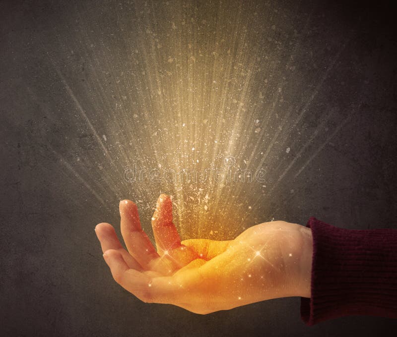 Hand holding yellow light stock photo. Image of charity - 114142796
