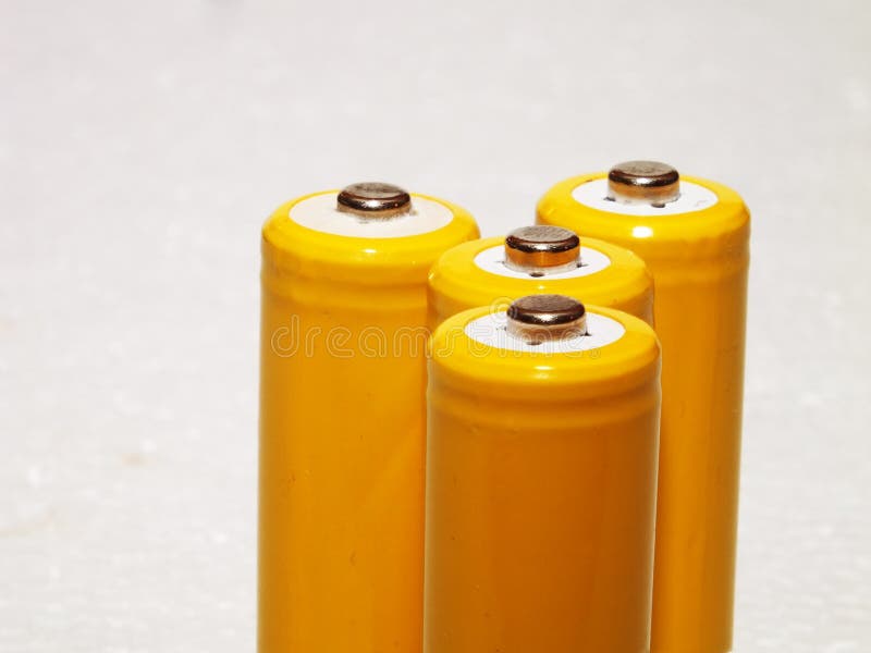 Yellow Rechargeable Batteries Stock Photo - Image of electronics, watt ...