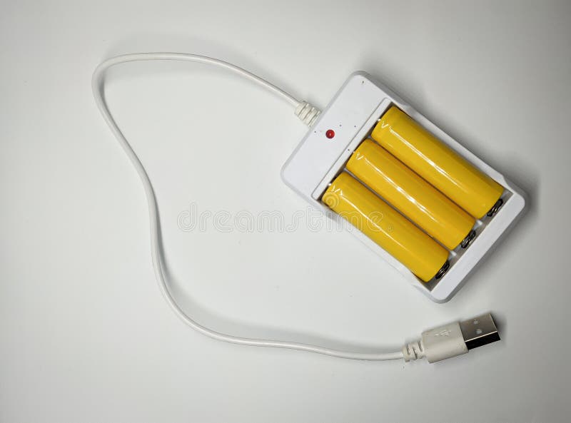 Yellow Rechargeable Battery and Charger Stock Photo - Image of ...