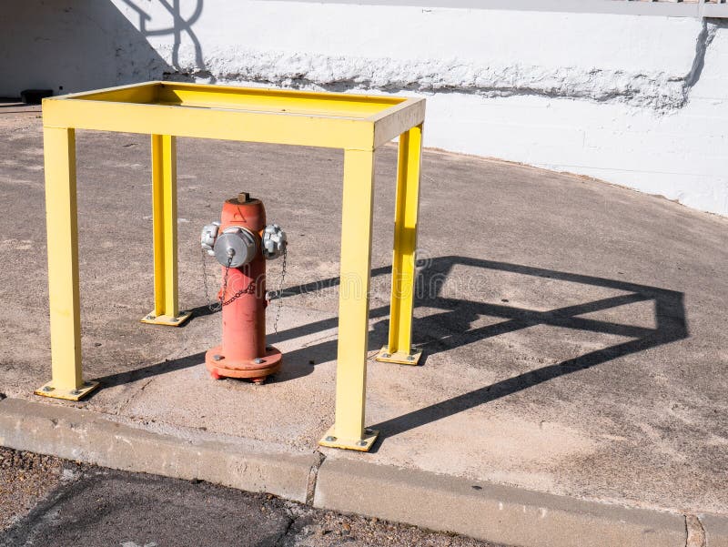 Yellow Rectangular Metal Structure Protecting a Fire Hydrant Stock ...
