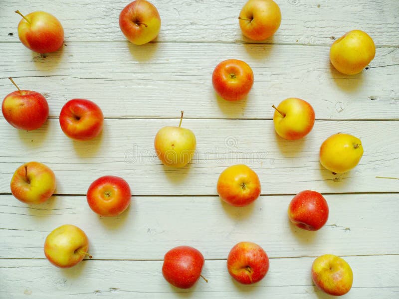 Yellow and Red Apples are on the White Boards Stock Photo - Image of ...