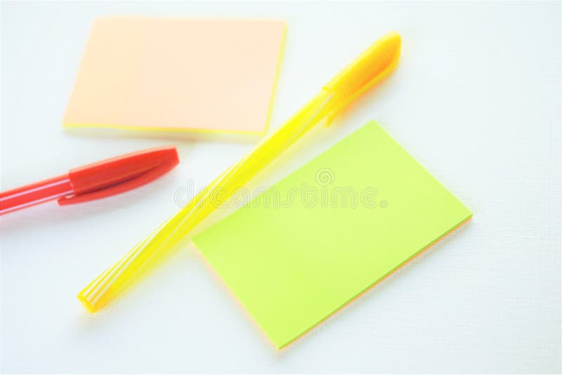 Yellow and Red Ballpoint Pen and Notes on White Paper Stock Image ...