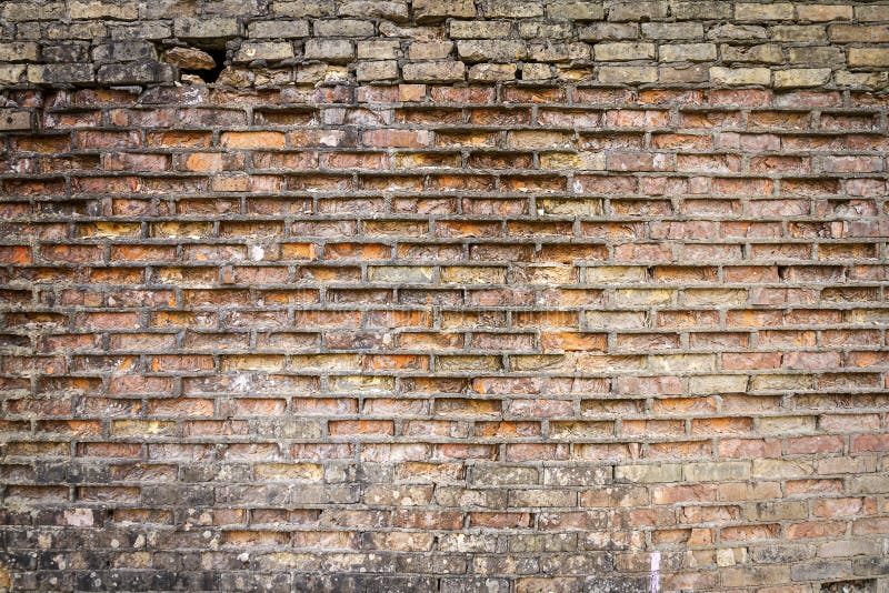 Yellow and red brick wall stock photo. Image of pattern - 250893024