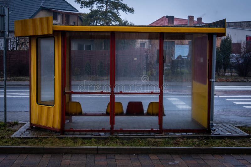 Yellow and Red Bus Stop on the Sidewalk in an Urban Area with a Missing ...