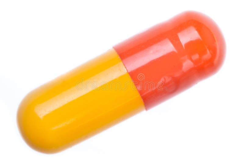 Red and yellow capsule stock photo. Image of closeup - 44896838