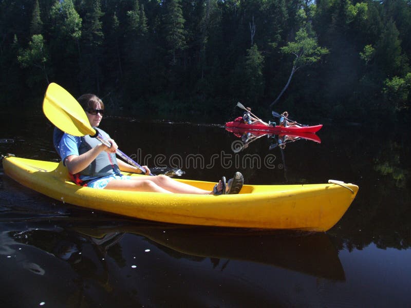 Yellow and red kayaks stock image. Image of beautiful - 3114017