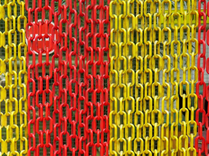 Yellow and Red Plastic Chains Hanging Next To Each Other. Stock Photo ...