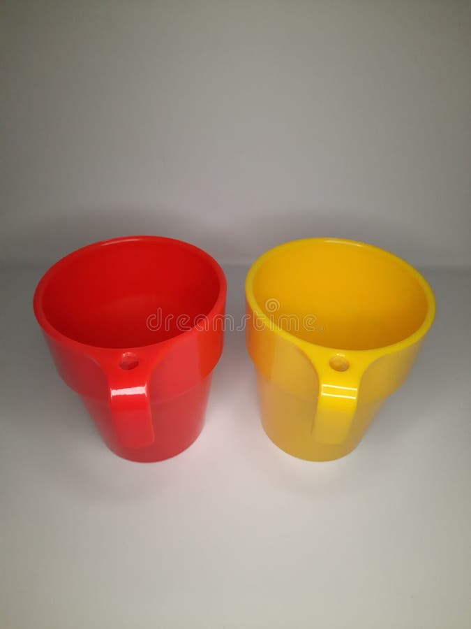 Yellow and Red Plastic Cups Stock Photo - Image of light, plastic ...