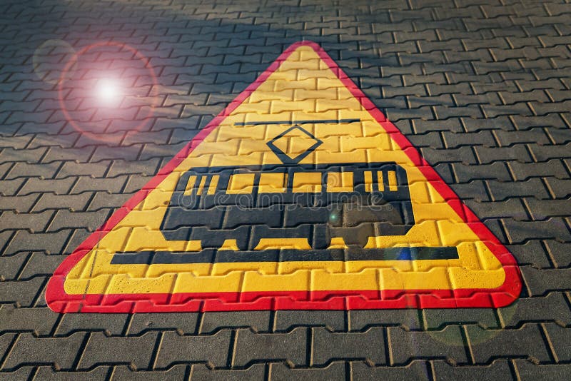 Yellow Red Triangular Tram Sign Drawn on the Road, Sun Glare Effect ...