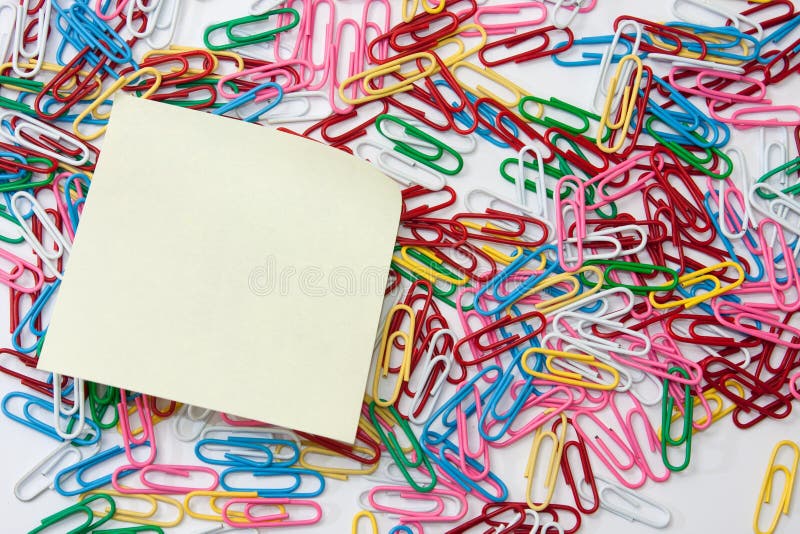 Yellow Reminder Sticker on the Pile of Paperclips Stock Image - Image ...