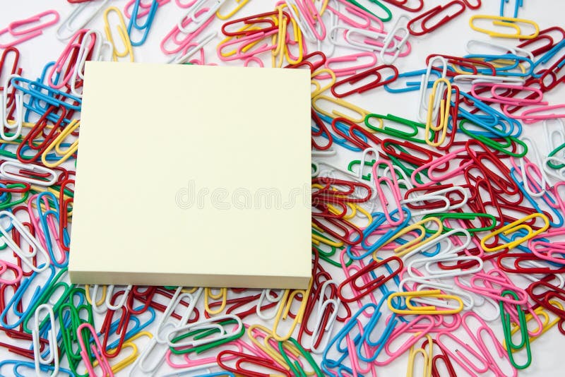 Yellow Reminder Sticker on the Pile of Paperclips Stock Image - Image ...