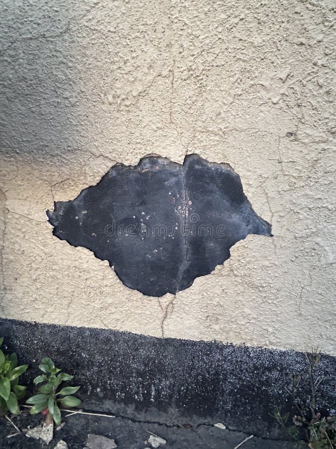 Yellow Rendered Wall with Large Area of Broken Render Stock Image ...