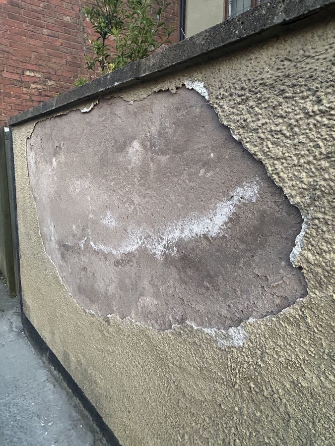 Yellow Rendered Wall with Large Area of Broken Render Stock Image ...