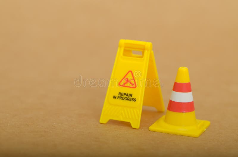 Yellow Repair in Progress Sign: Symbol of Caution and Incomplete Work ...