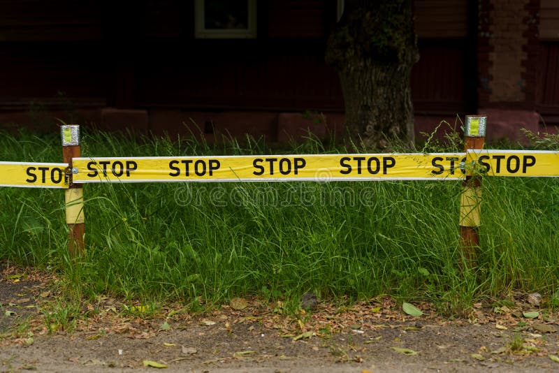 Yellow Restrictive Tape with the Inscription - Stop. Stock Photo ...
