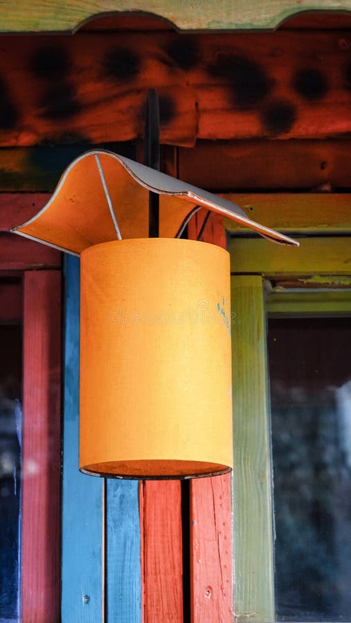 A Yellow Retro Interior Light Hanging from a Wooden Ceiling Accent ...