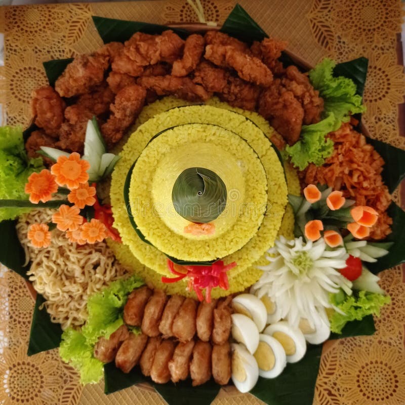 Yellow Rice Cone (Nasi Tumpeng) with Side Dishes and Vegetables Served ...