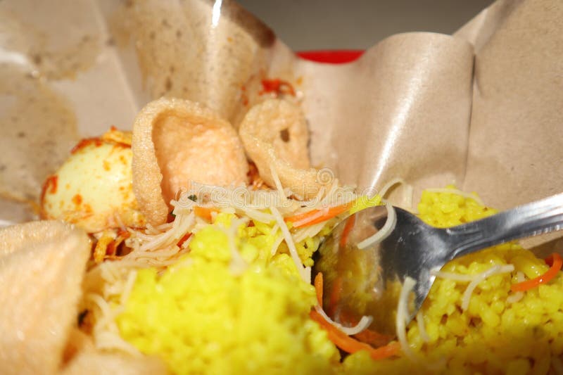 Yellow Rice with Crackers and Balado Egg Stock Photo - Image of salad ...