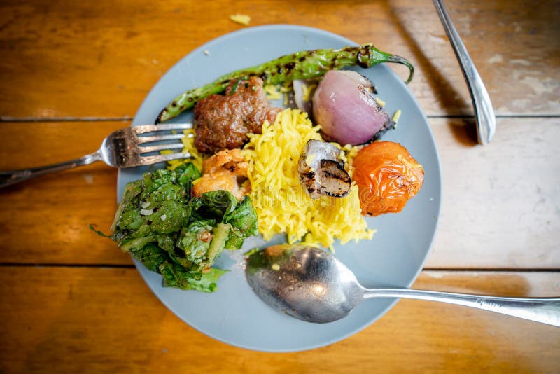 Yellow Rice with Meat. Roasted Tomato and Onion Toppings Stock Photo ...