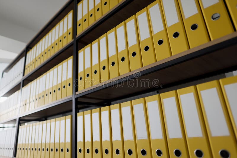 Yellow Ring Binders with Files Put in Long Rows on Shelves Stock Image ...